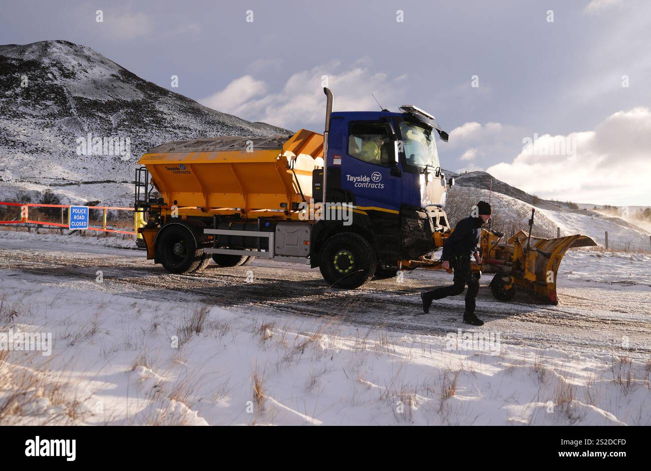 A snow plough driver at the closed snow gates on the A93 in Spittal of ...