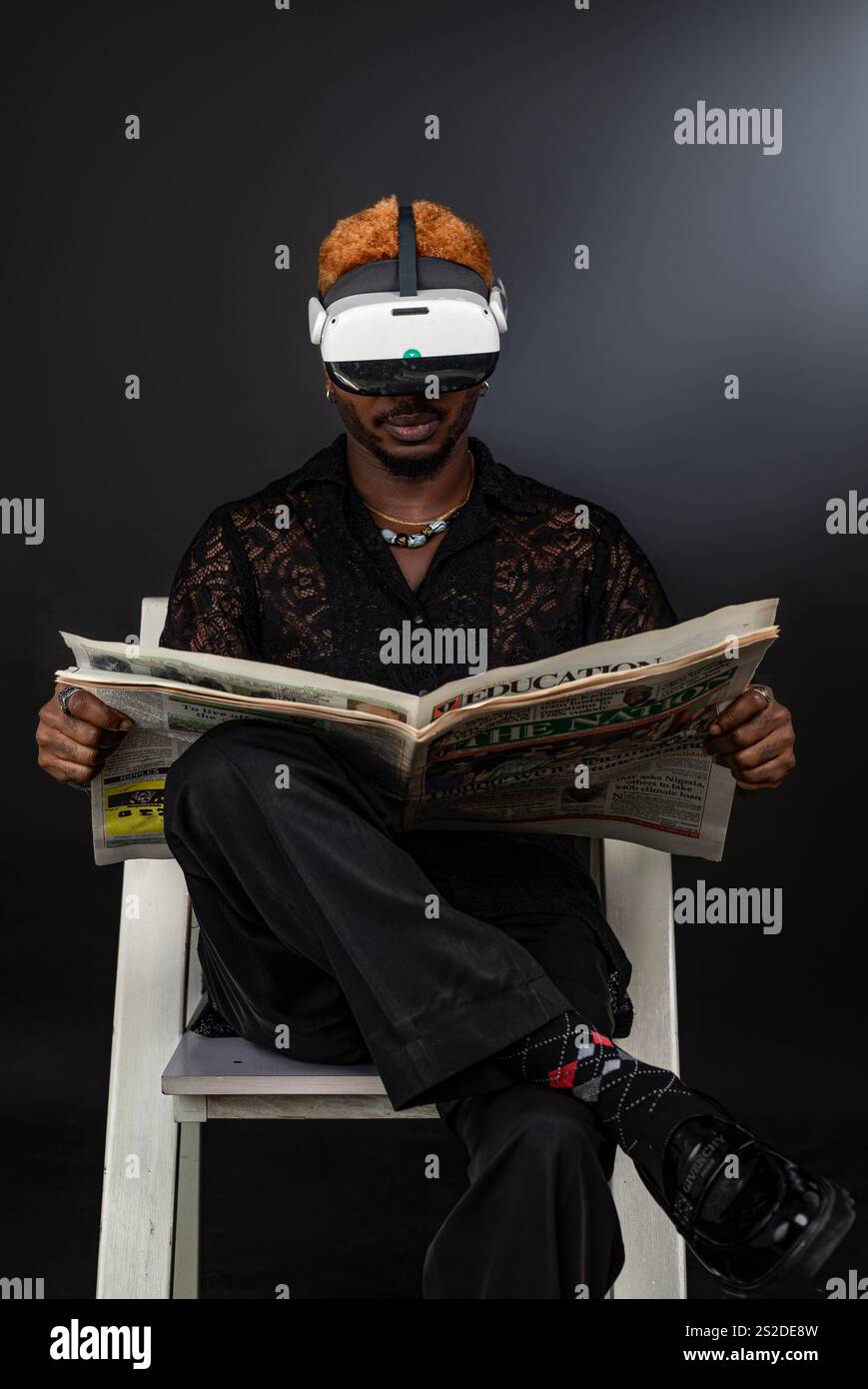 corporate black CEO boss on VR set reading a Newspaper Stock Photo - Alamy