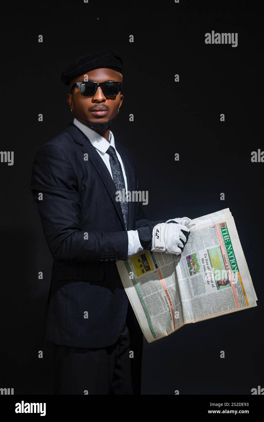 corporate black CEO boss on VR set reading a Newspaper Stock Photo - Alamy