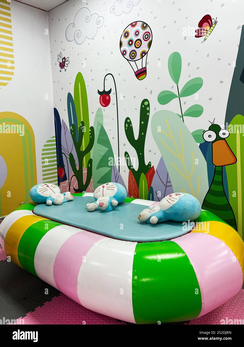 A playful and vibrant space featuring colorful furniture, cartoon ...