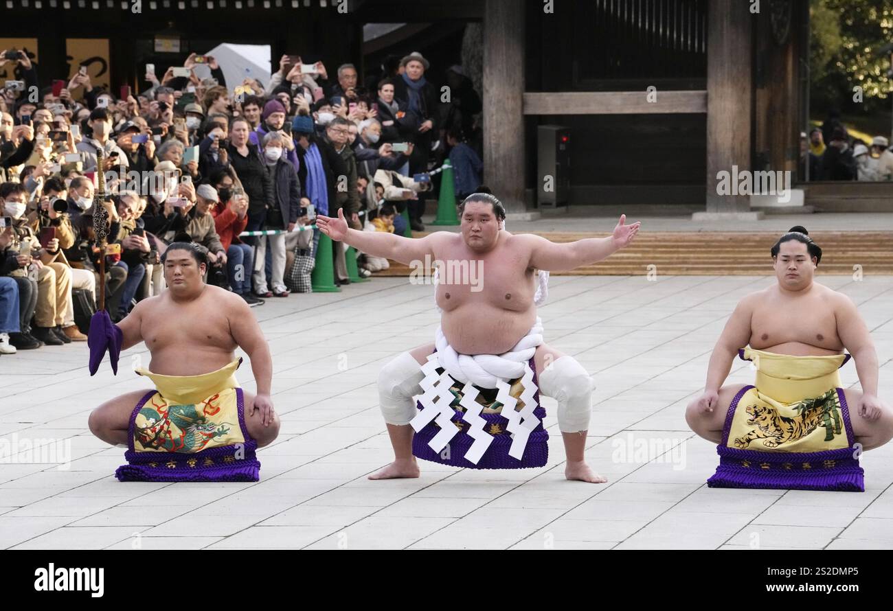 Sumo grand champion Terunofuji (C) performs a ring-entering ritual at ...
