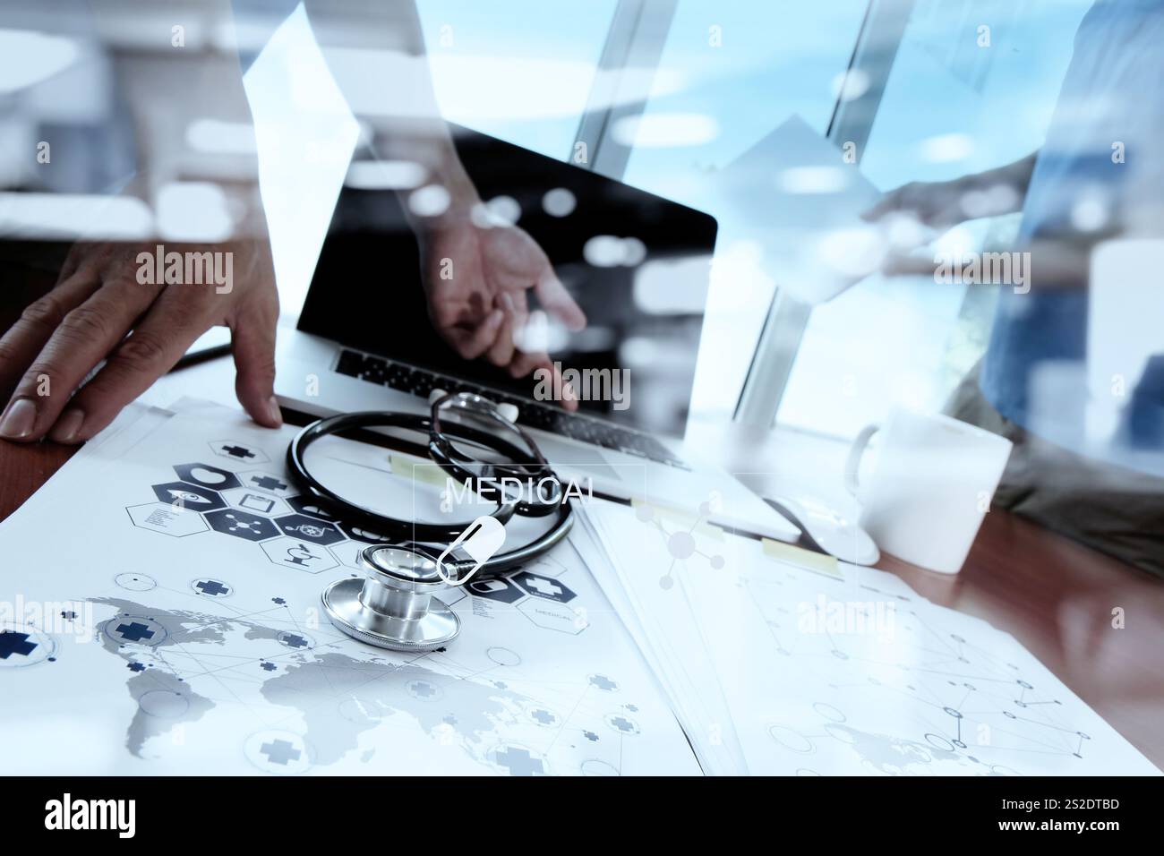 Doctor working with digital tablet and laptop computer in medical ...