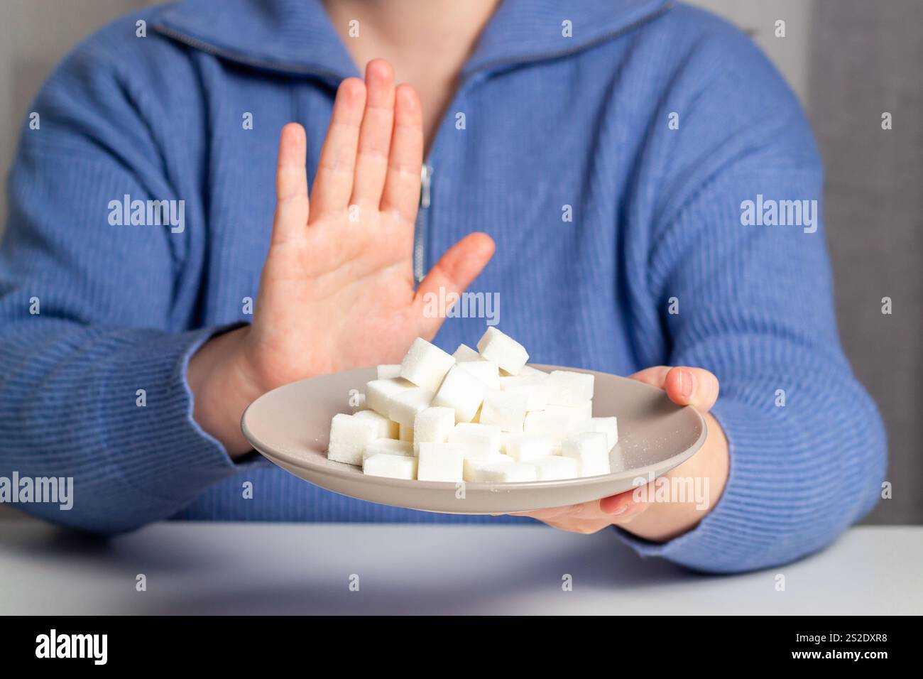 Woman decided to stop eat sugar for health and weight loss. Hand stop ...
