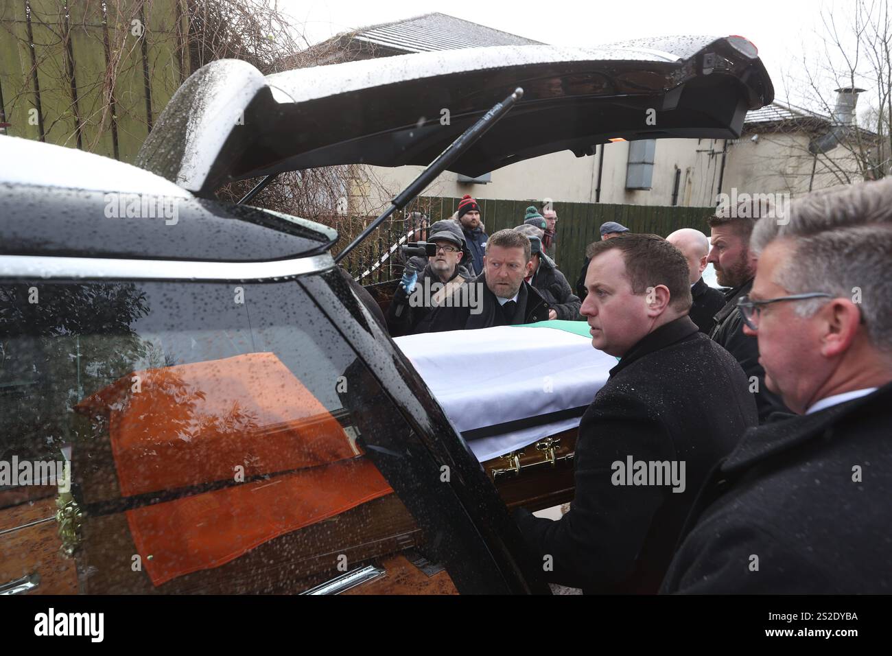 The coffin of Ted Howell is taken from his home on Suffolk Road in west ...
