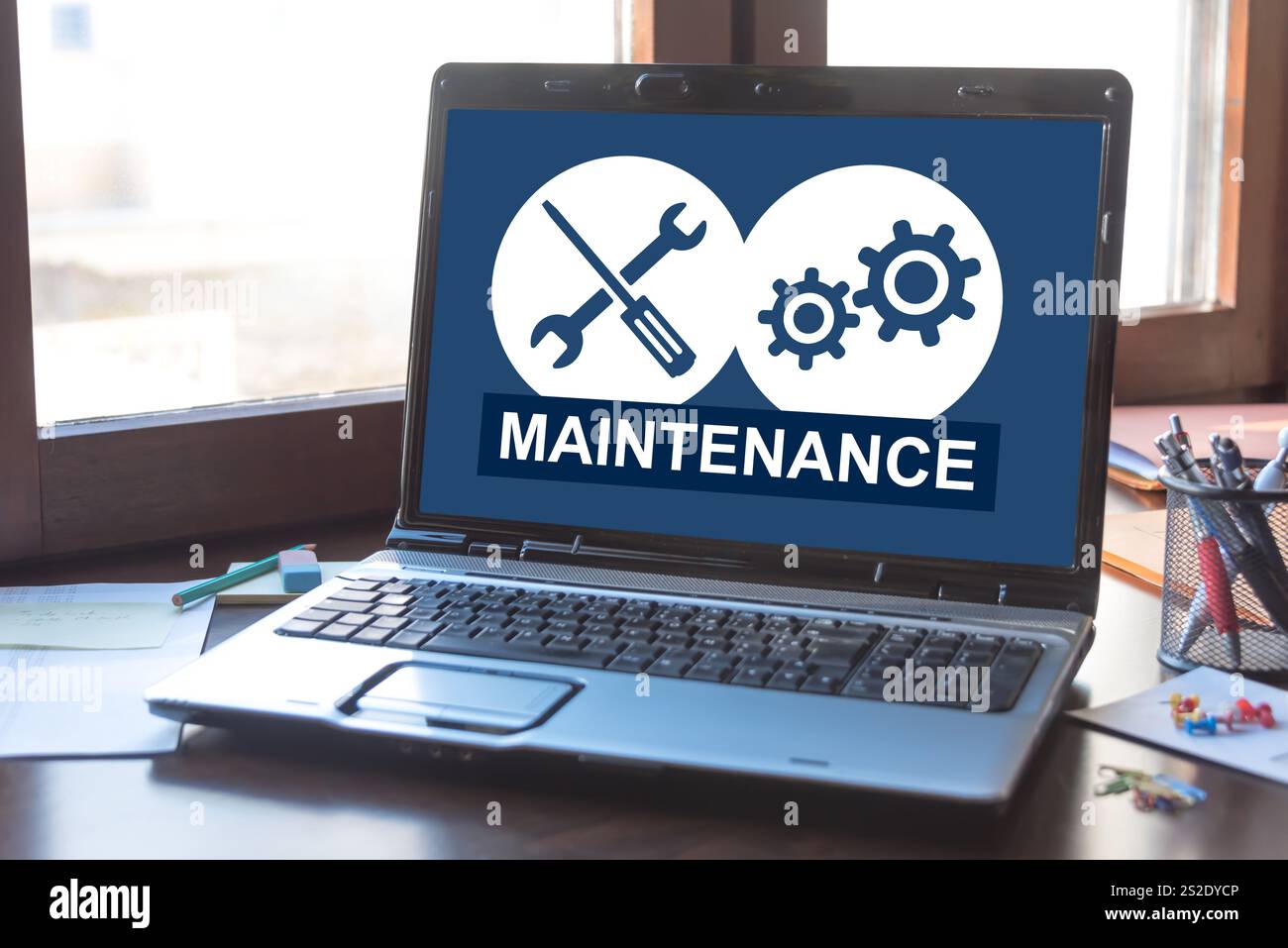 Laptop screen displaying a maintenance service concept Stock Photo - Alamy