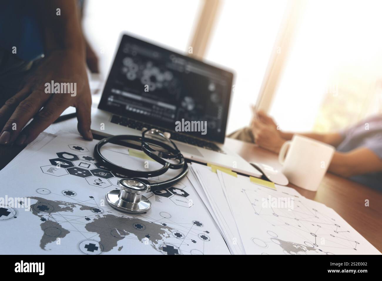 team doctor working with laptop computer in medical workspace office ...