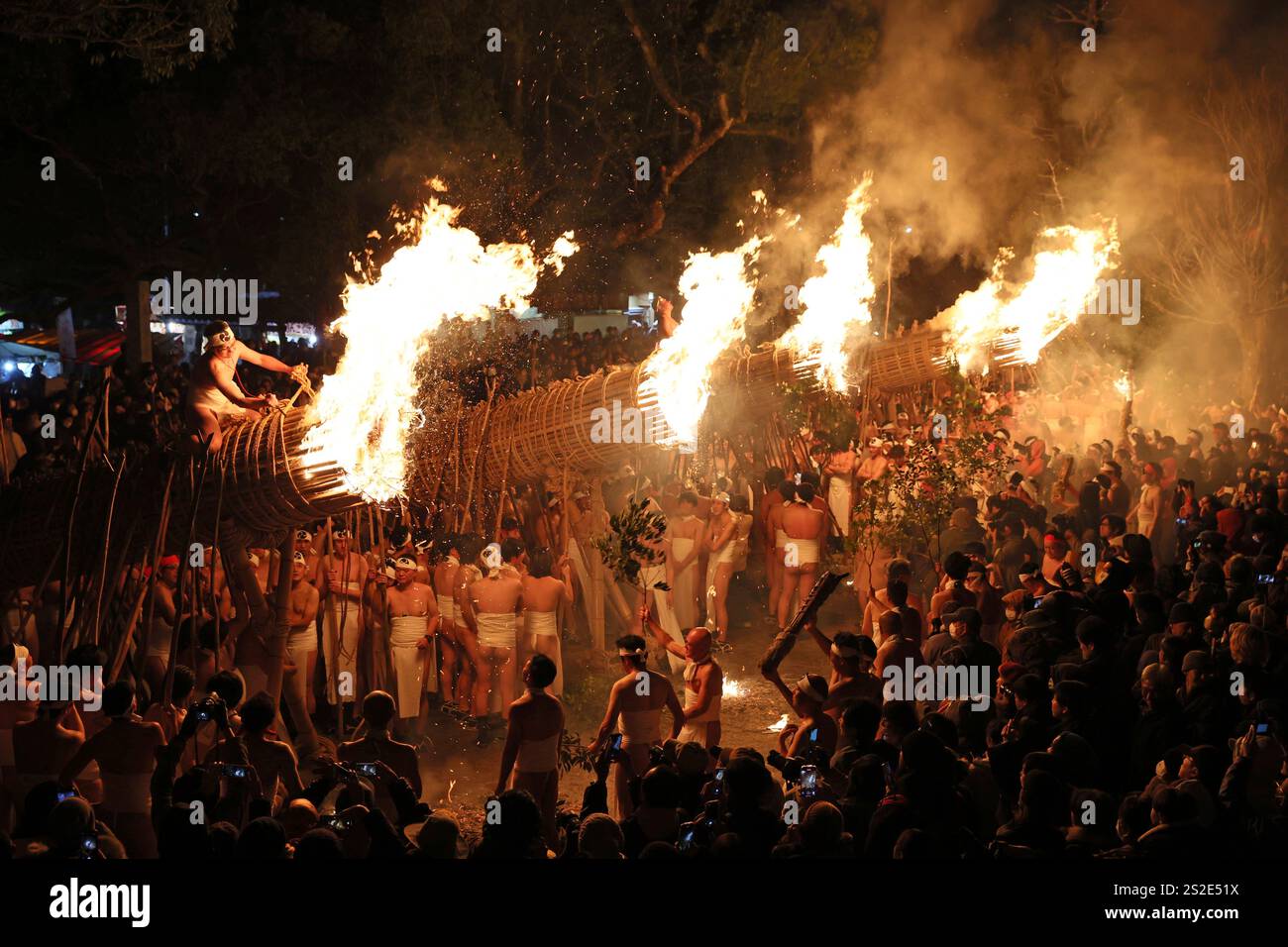 Huge torches are lit all at once to burst into flames during a fire ...