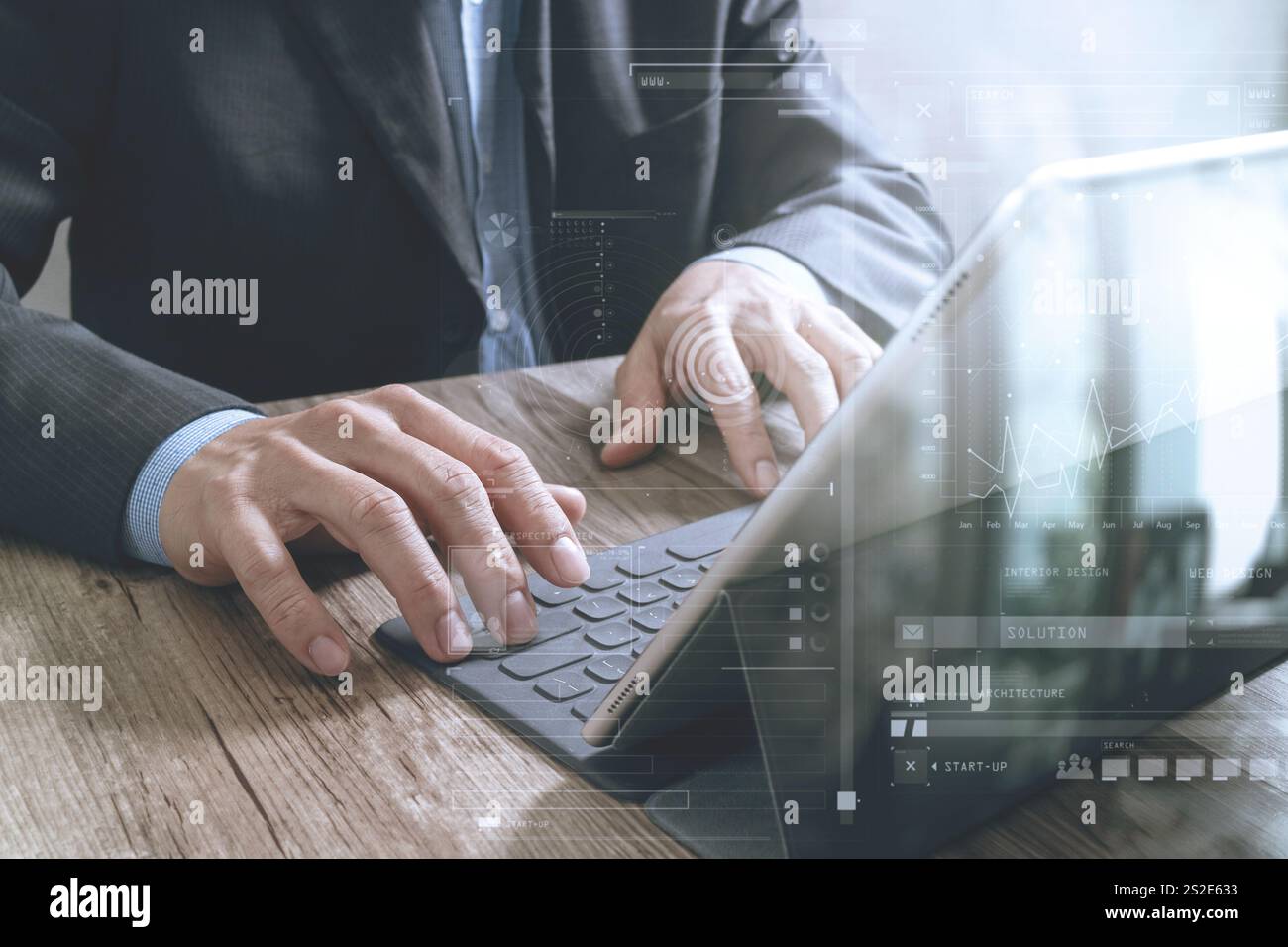 success businessman hand working with digital tablet docking smart keyboard on wooden desk,icons ...