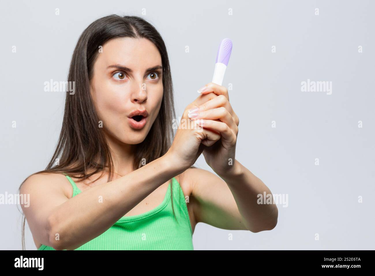 Young woman discovers the result of her pregnancy test and seems ...