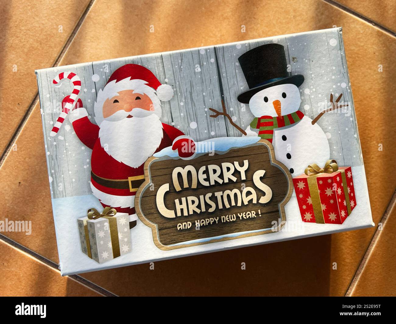 Kyiv, Ukraine - January 07, 2025: A cheerful gift box with Santa Claus ...