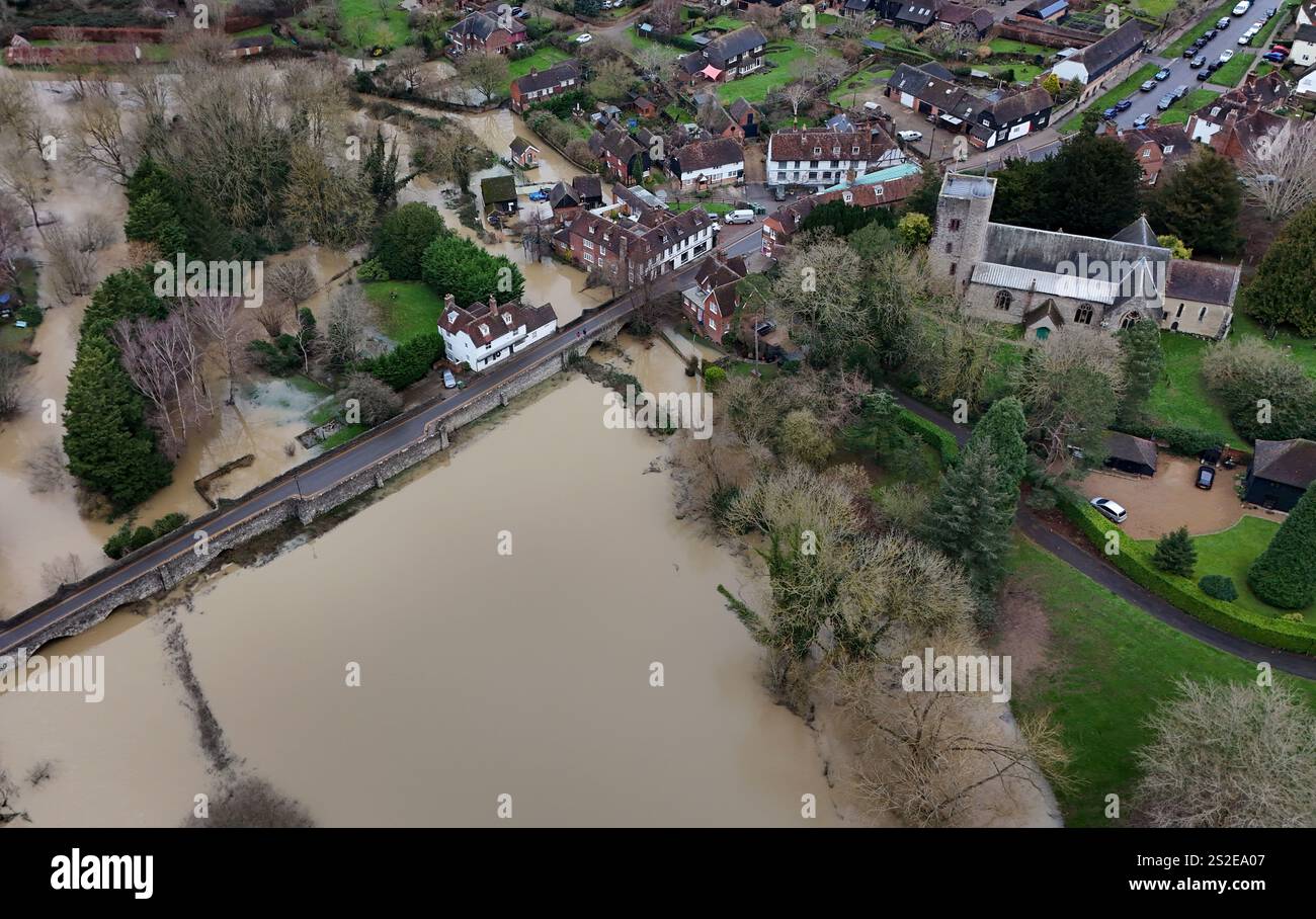 Flood waters approach the village of Yalding in Kent. Weather warnings ...