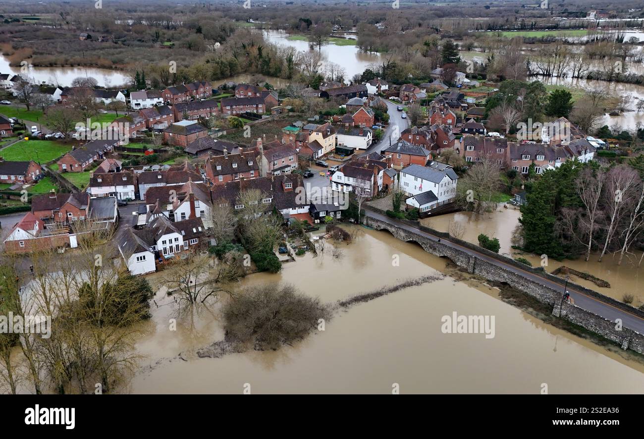 Flood waters approach the village of Yalding in Kent. Weather warnings ...