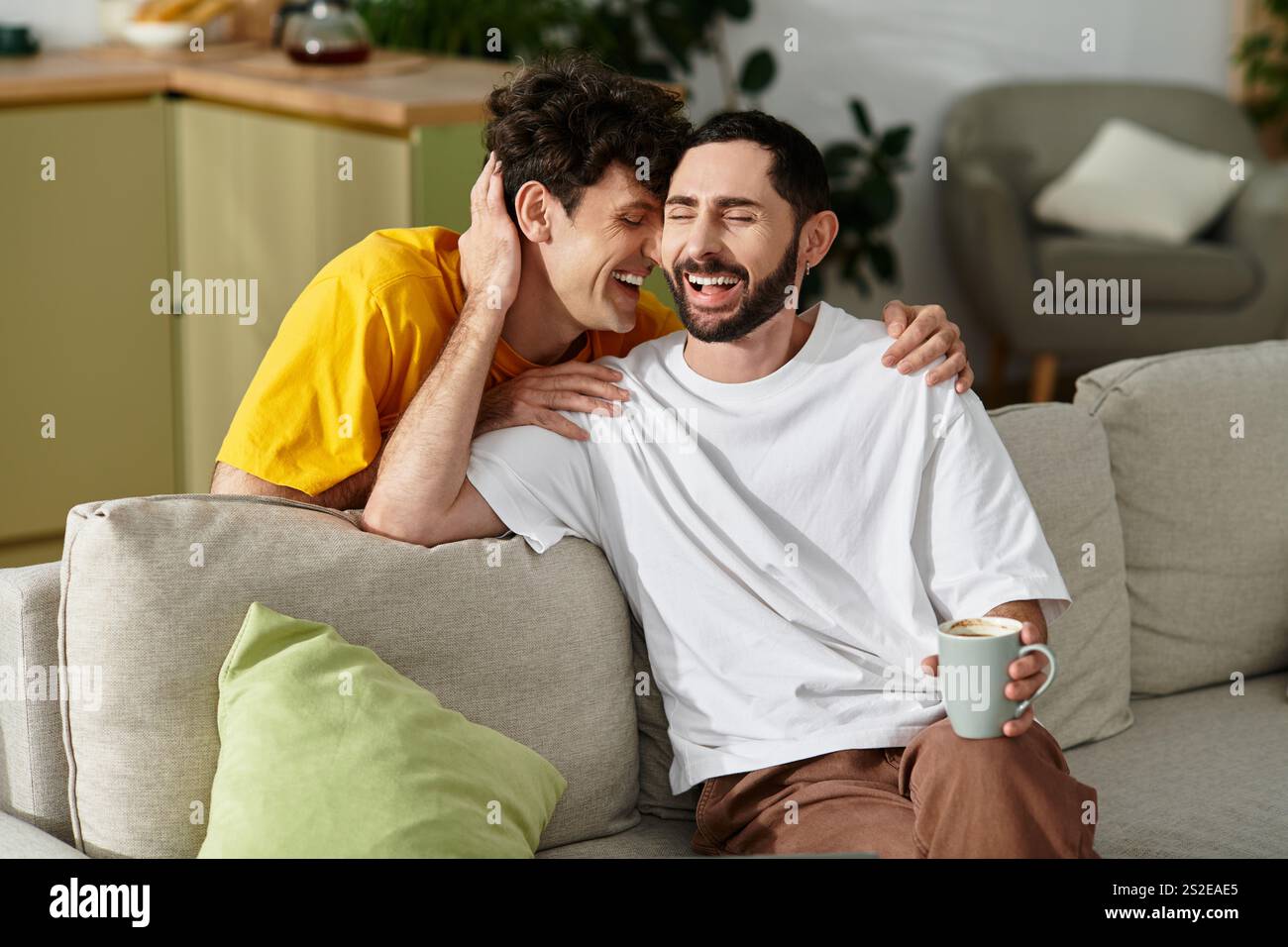 Two men express their love and happiness while enjoying a cozy moment ...