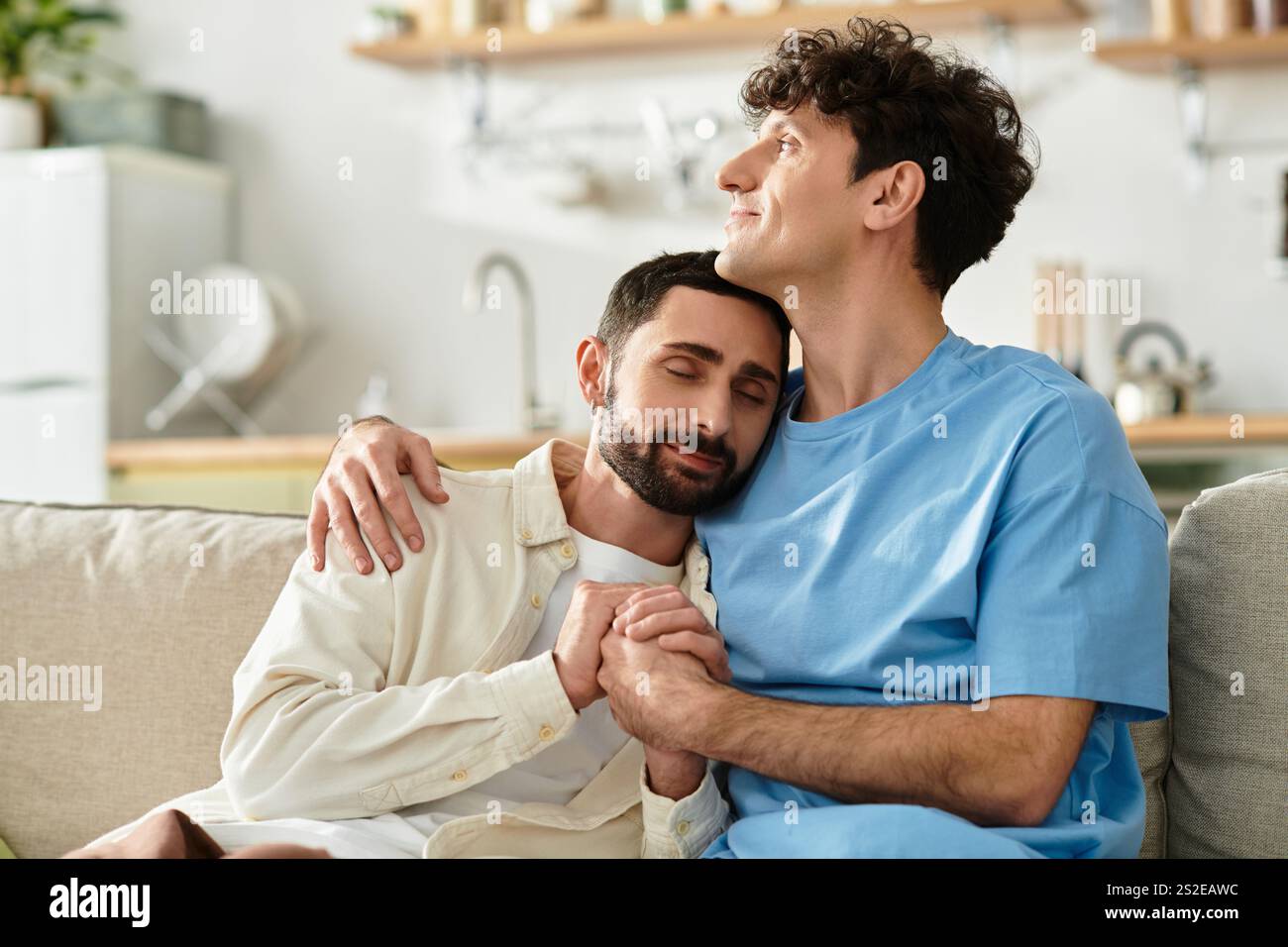 Two men express their love while enjoying a relaxed moment together at ...