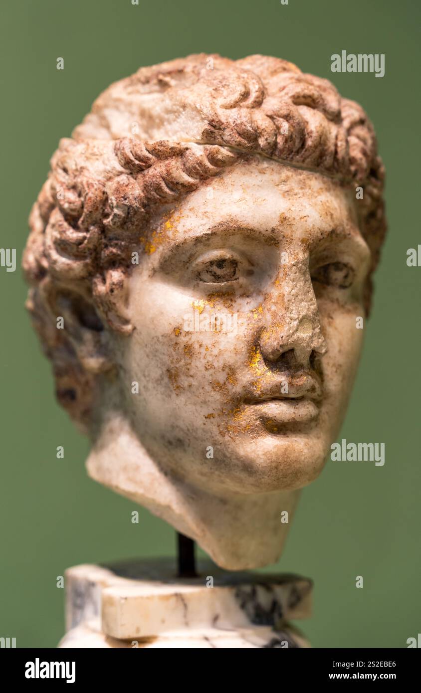 Close-up on male head in ruins of ancient roman statue sculpted in ...