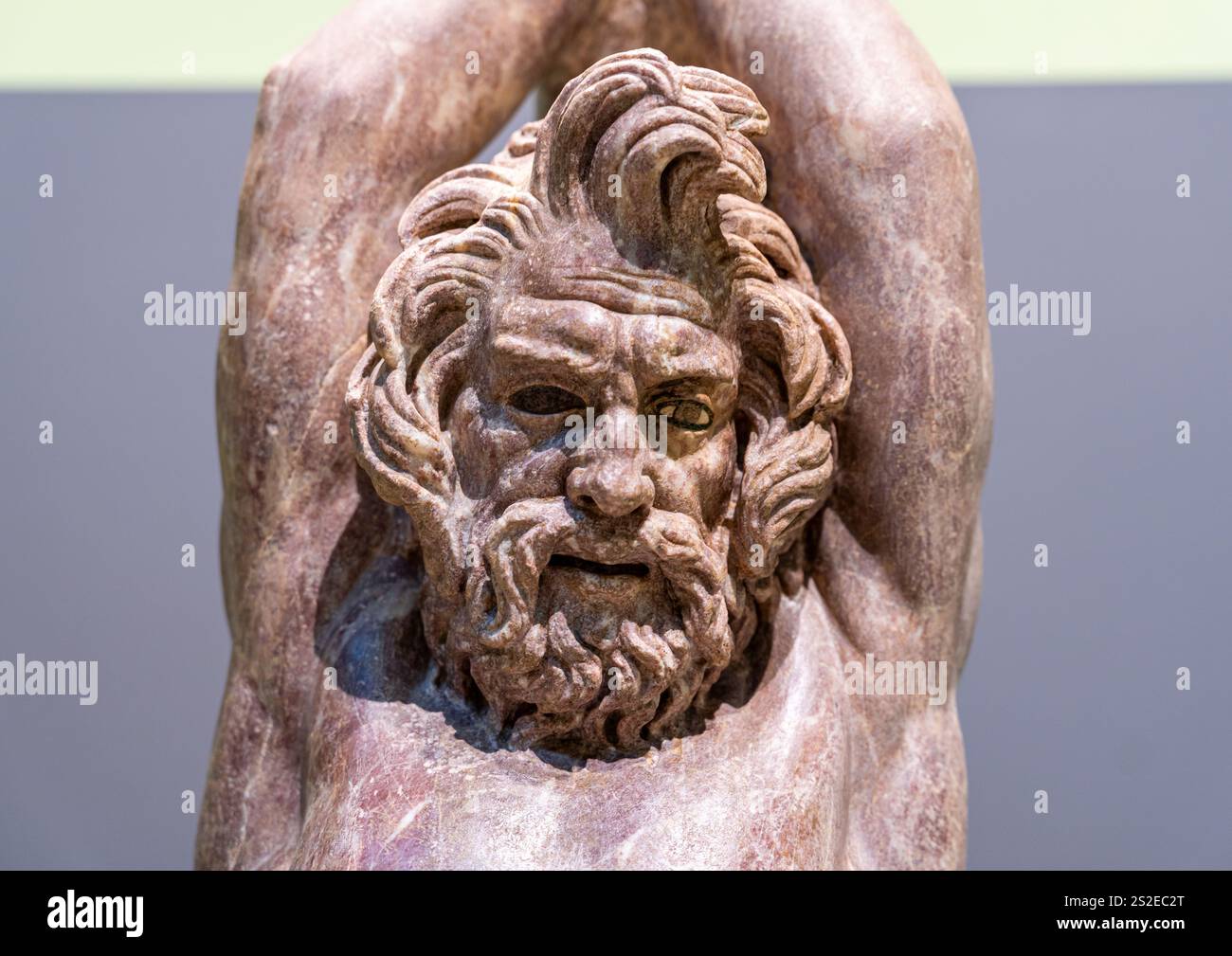 Close-up on the suffering face of ancient marble statue portraiting a ...