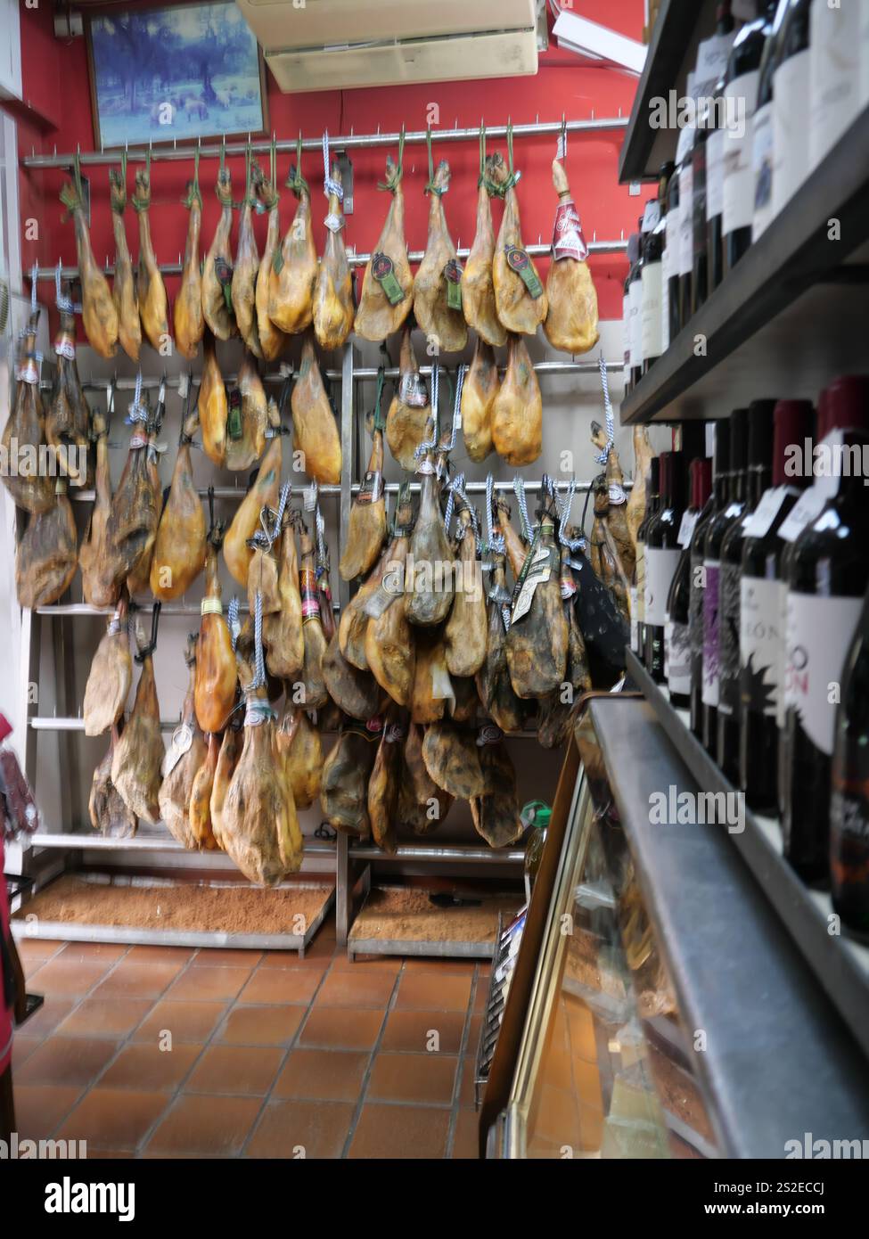 Typical Andalusian ham hangs in a shop in Ronda Spain Stock Photo - Alamy