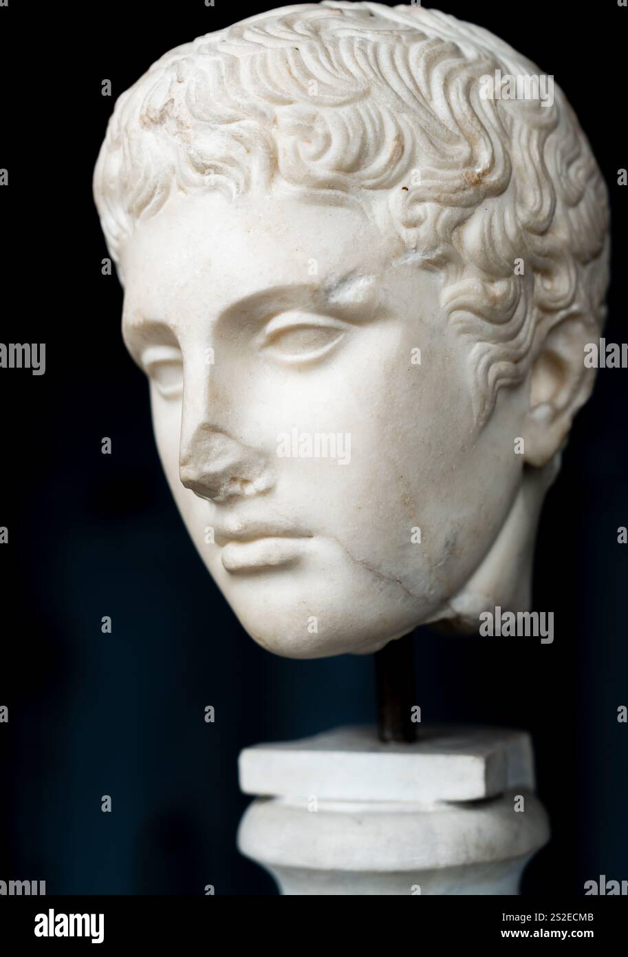 Close-up on head in ruins of ancient roman statue sculpted in marble ...