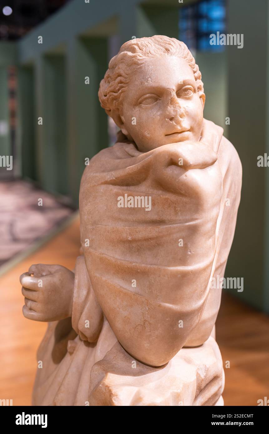 Close-up on ancient marble statue of roman woman wrapped in a ...