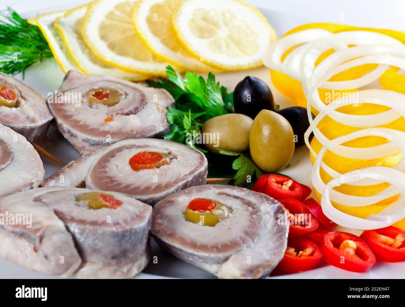 sliced fish with vegetables isolated on white background Stock Photo ...