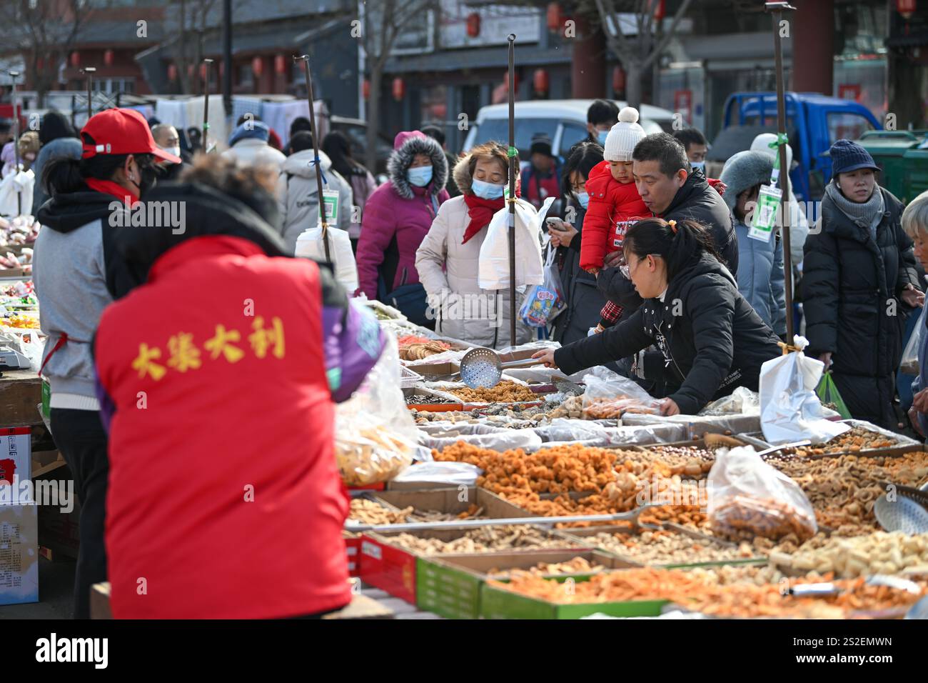 Tianjin. 7th Jan, 2025. People visit an open-air market in Ninghe ...