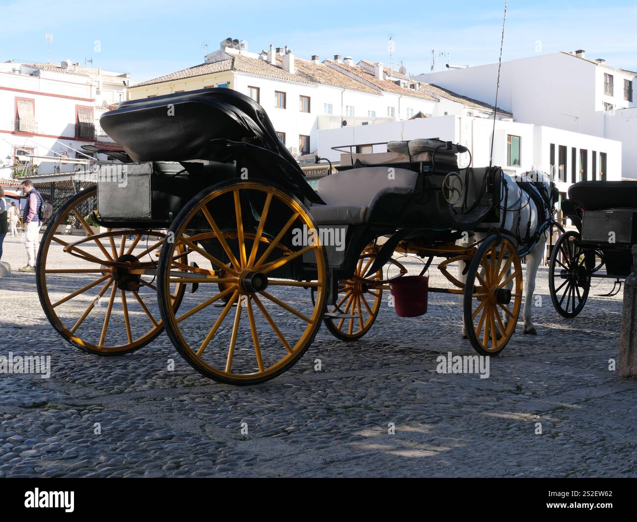 Black yellow open carriage waiting for tourists in Ronda Spain Stock ...