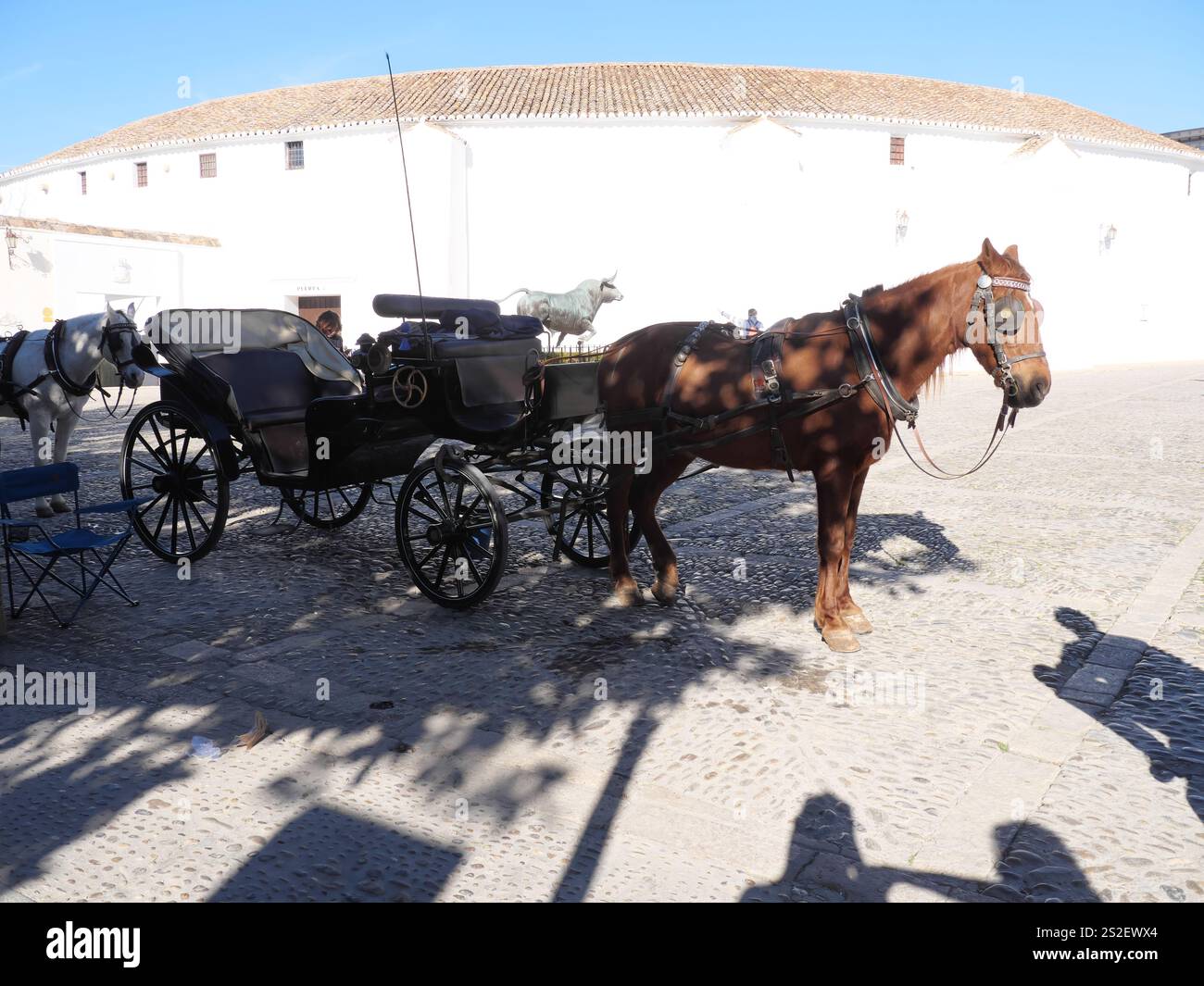 Black yellow open carriage waiting for tourists in Ronda Spain Stock ...