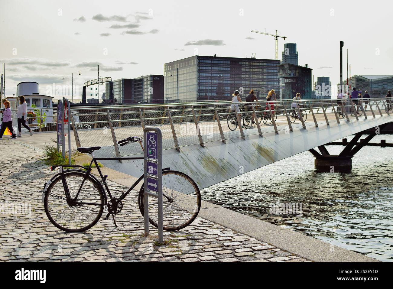 Copenhagen, Denmark. January 7, 2025. Parked bicycle near the bridge in ...