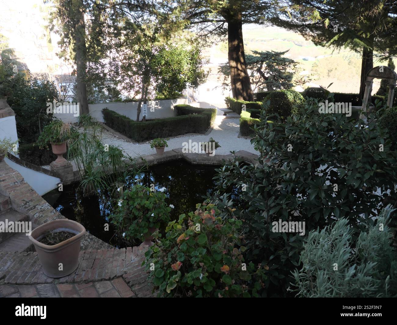 Geometric garden with hedges and fountains at the old Moorish palace of ...