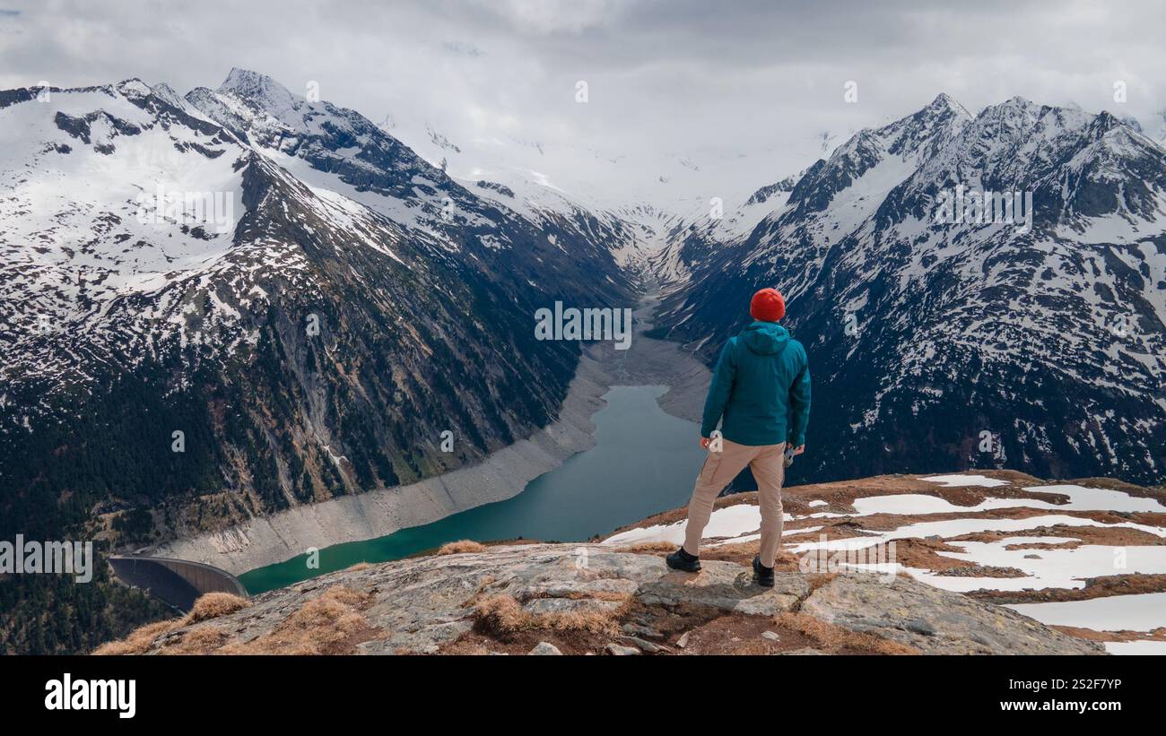 A man is hiking in the Austrian Alps. An extremely beautiful and epic ...