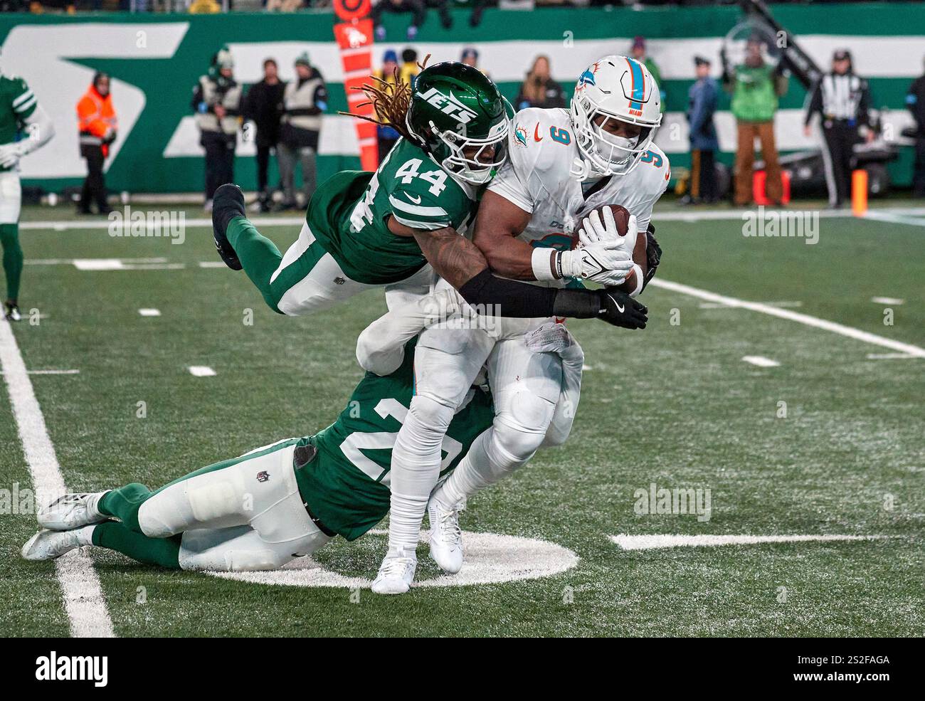 New York Jets linebacker Jamien Sherwood (44) and safety Tony Adams (22 ...