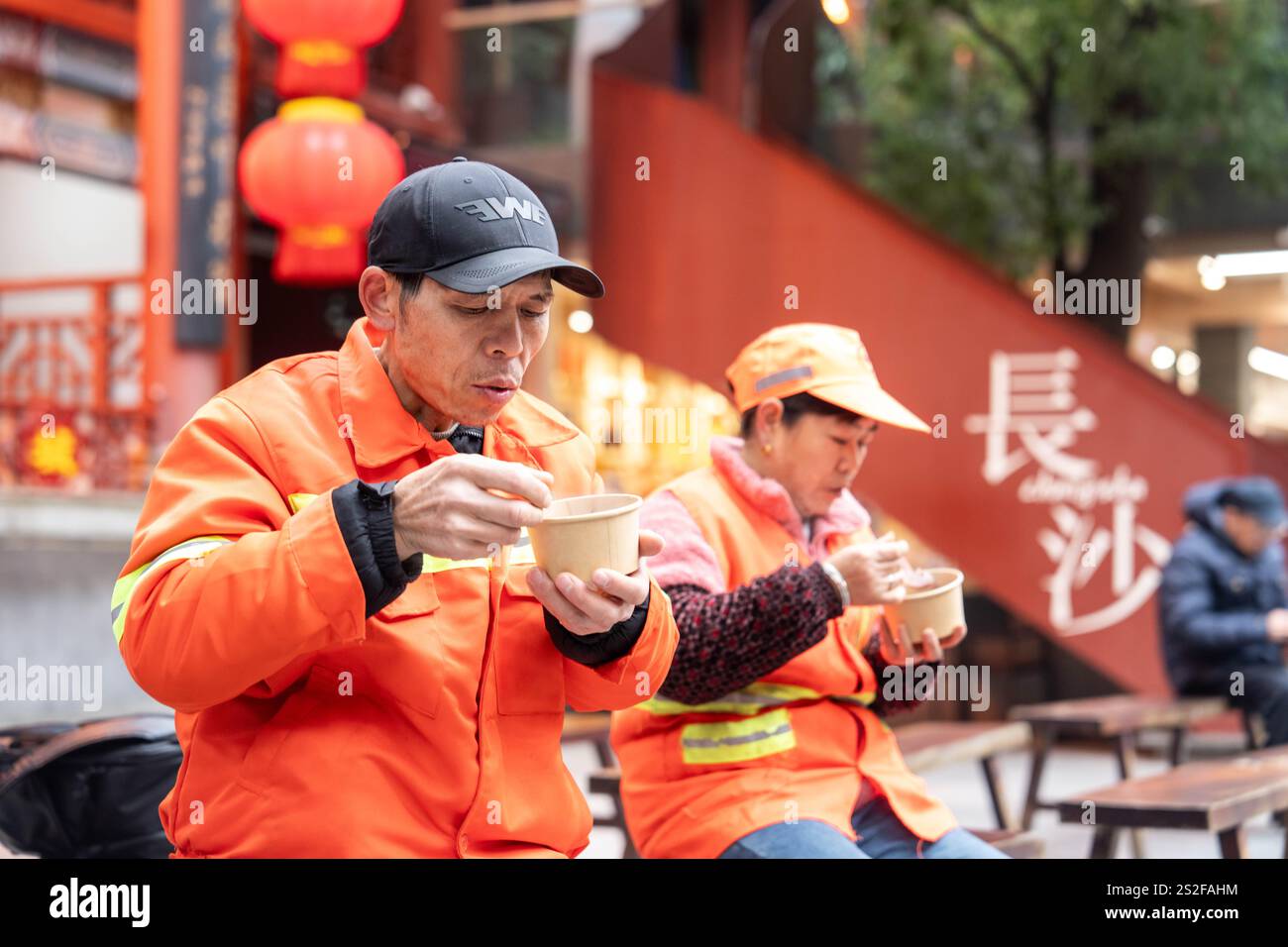 Beijing, China's Hunan Province. 7th Jan, 2025. Sanitary workers eat ...