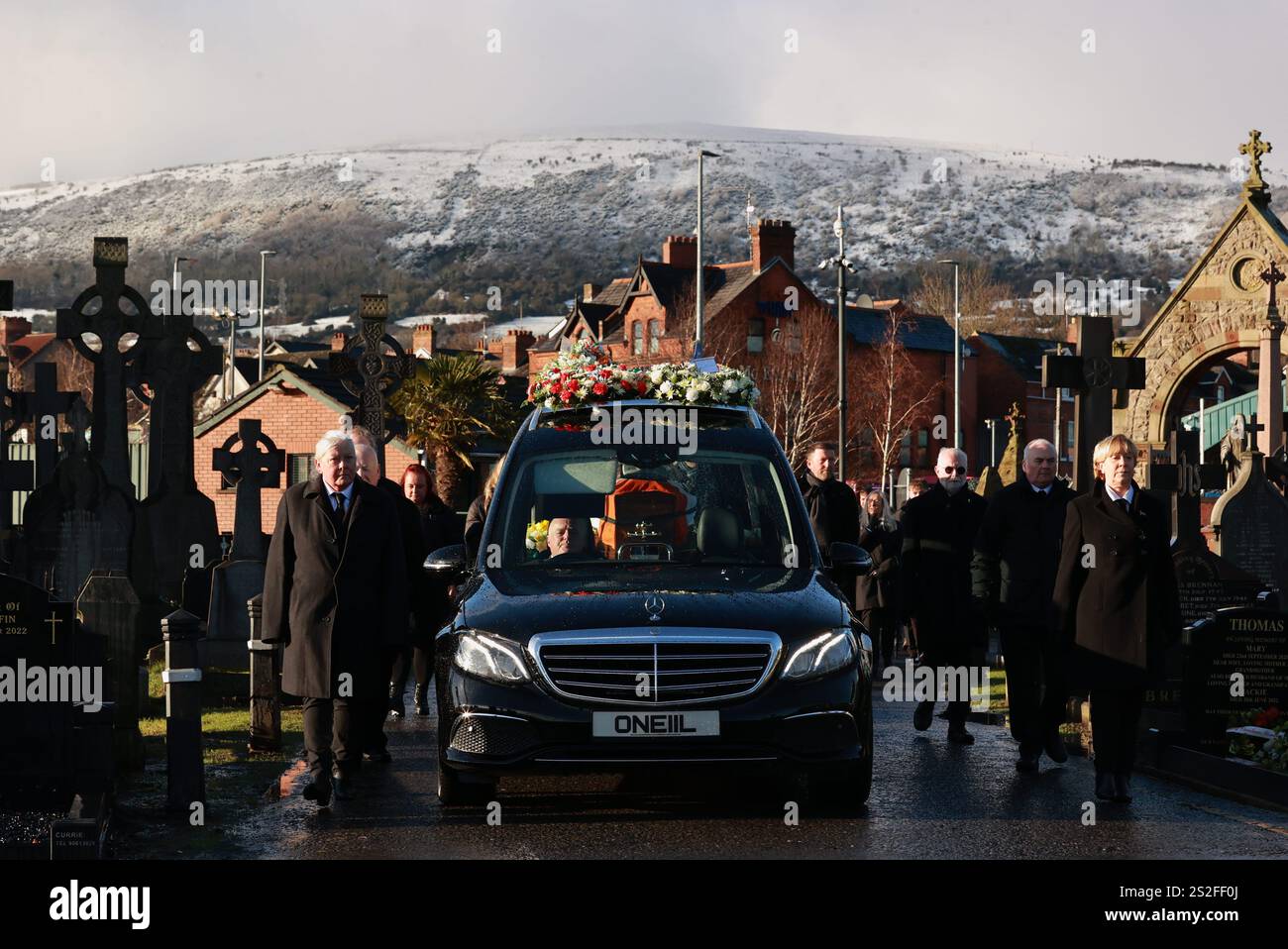 The coffin of Ted Howell arrives in Milltown Cemetery in west Belfast ...