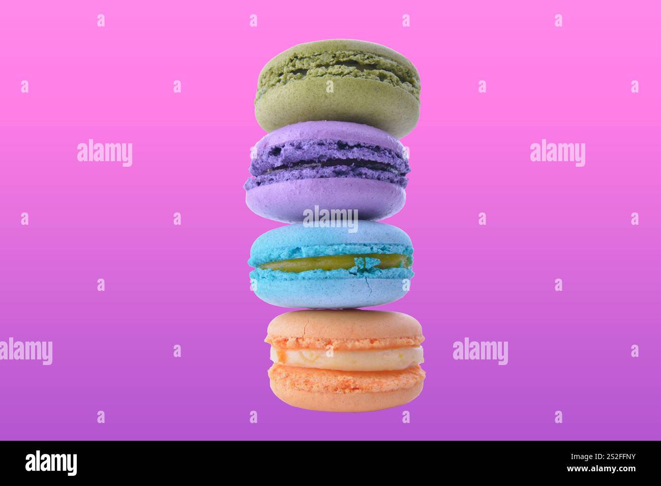 colorful macaroni on pink gradient background Stock Photo - Alamy