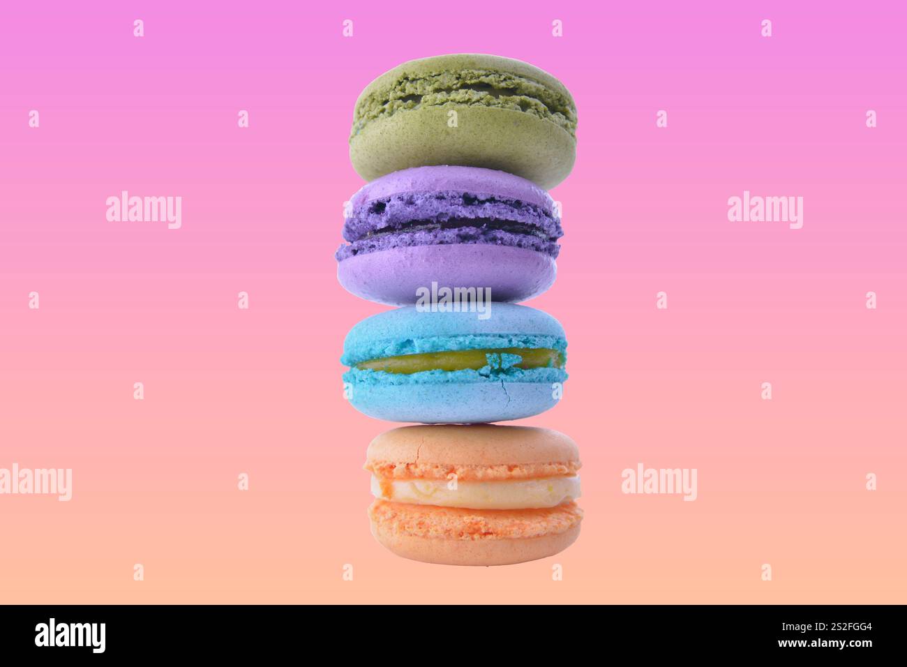 colorful macaroni on pink gradient background Stock Photo - Alamy