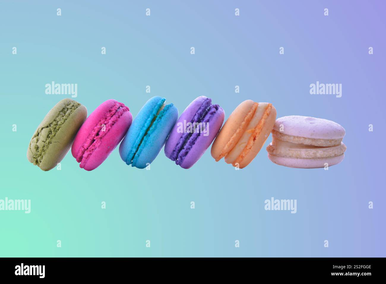 colorful macaroni on pink gradient background Stock Photo - Alamy