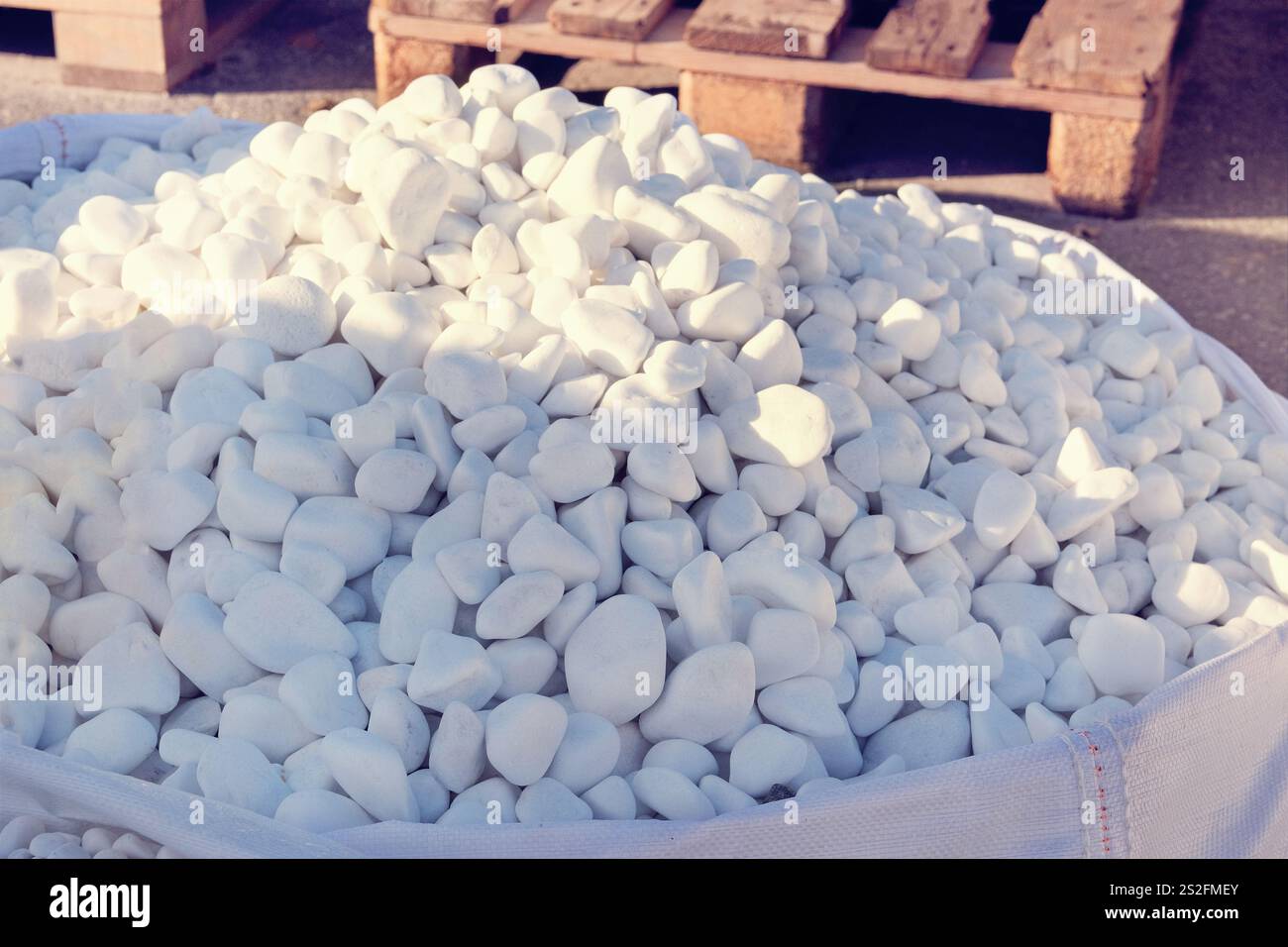 Piles of dolomite stones. White brick piles on a building project ...