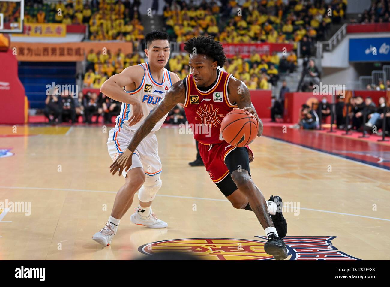 Taiyuan, China's Shanxi Province. 7th Jan, 2025. Brandon Goodwin (R) of ...