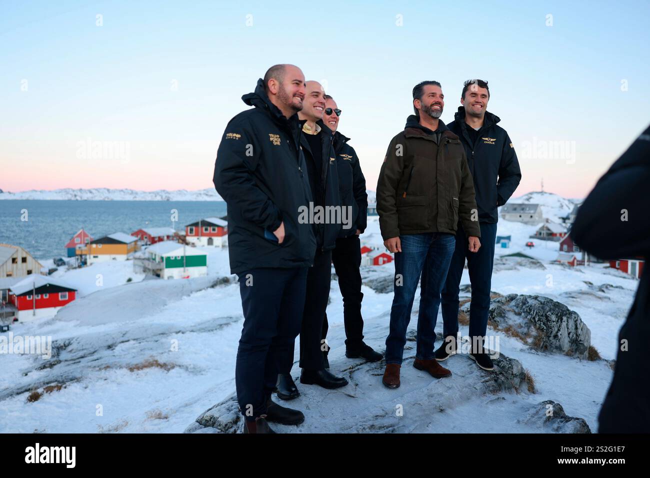 Donald Trump Jr., second right, poses for a picture upon his arrival in ...