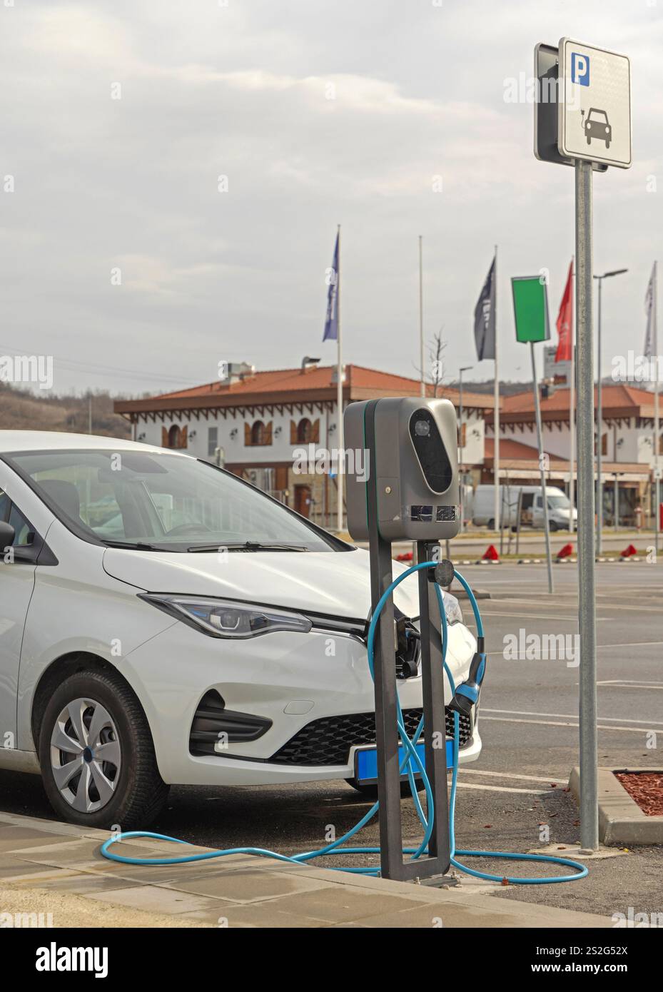Sign Pole Fast Charging Electric Vehicle At Public Parking Lot Stock ...