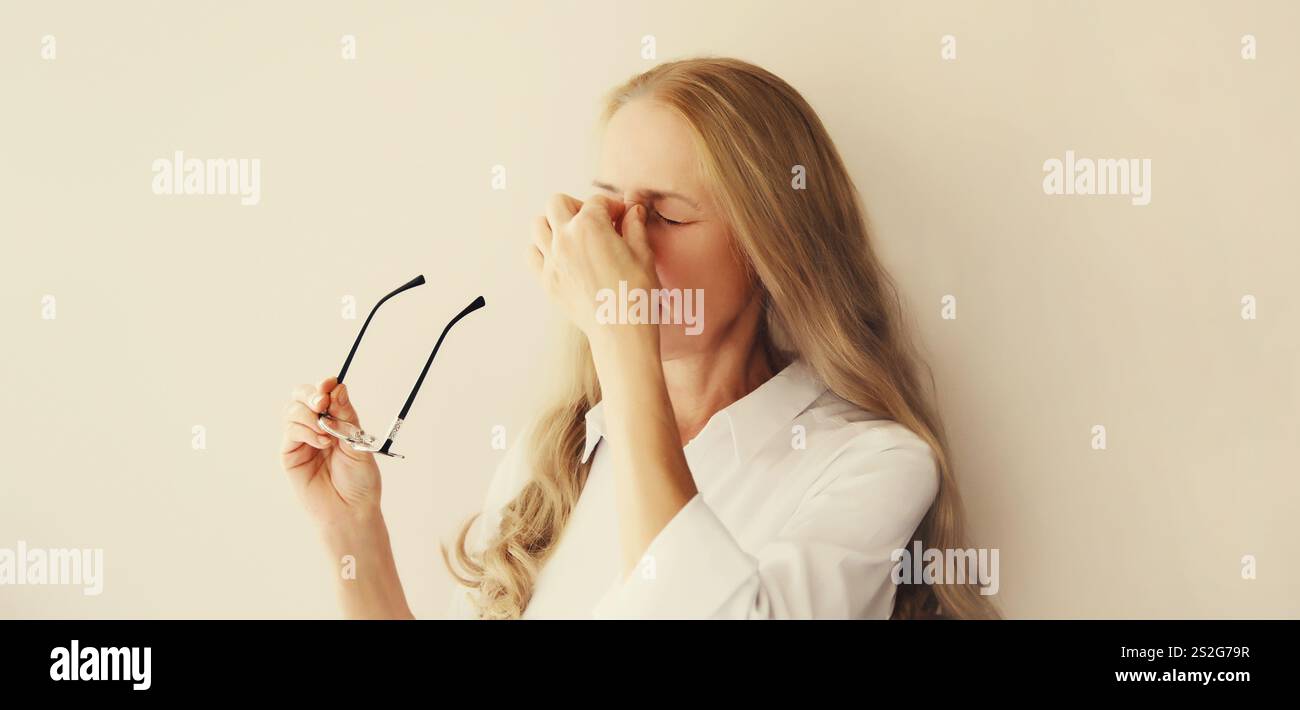 Tired overworked woman employee rubbing her eyes suffering from eye ...
