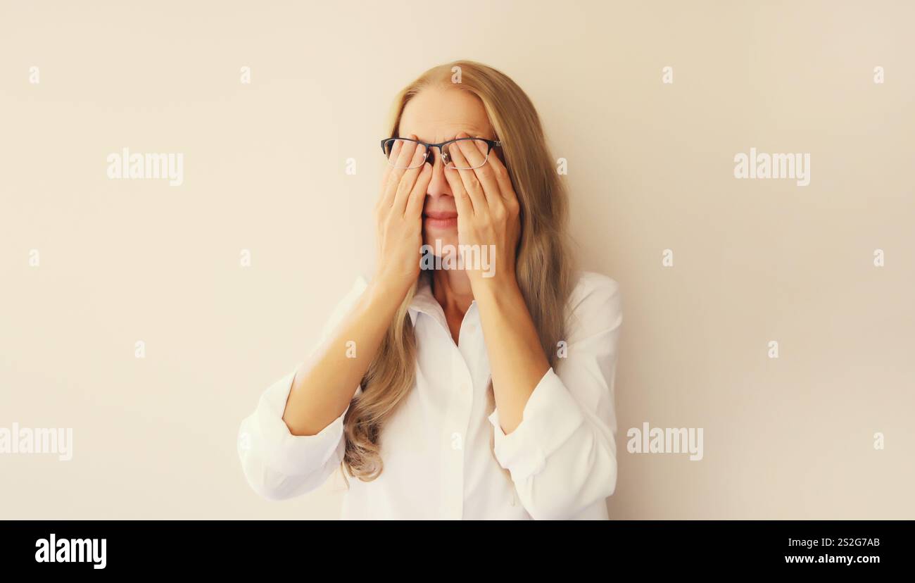 Tired overworked woman employee rubbing her eyes suffering from eye ...