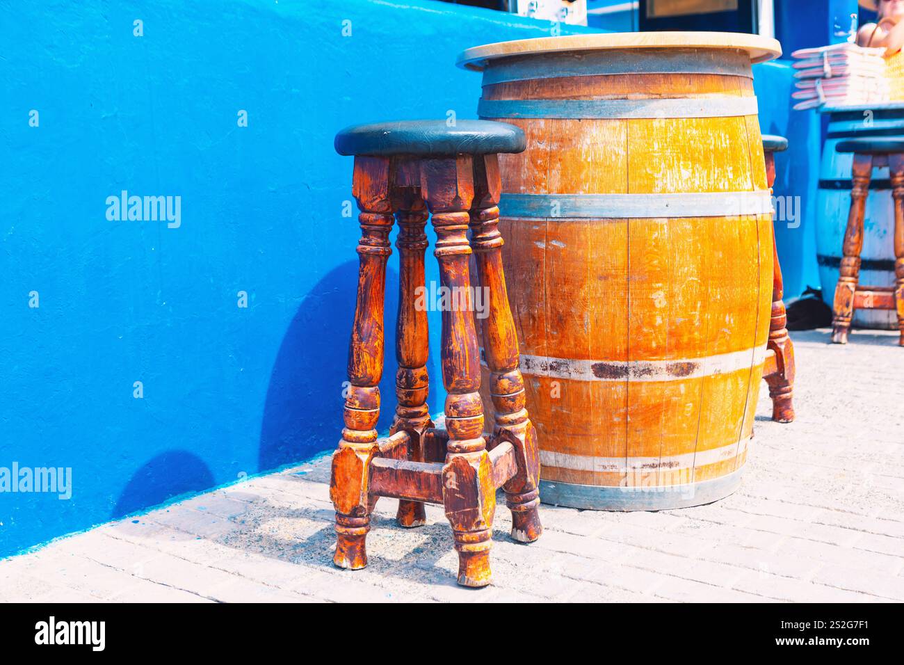 Rustic setup with a wooden barrel repurposed as a table and a matching ...