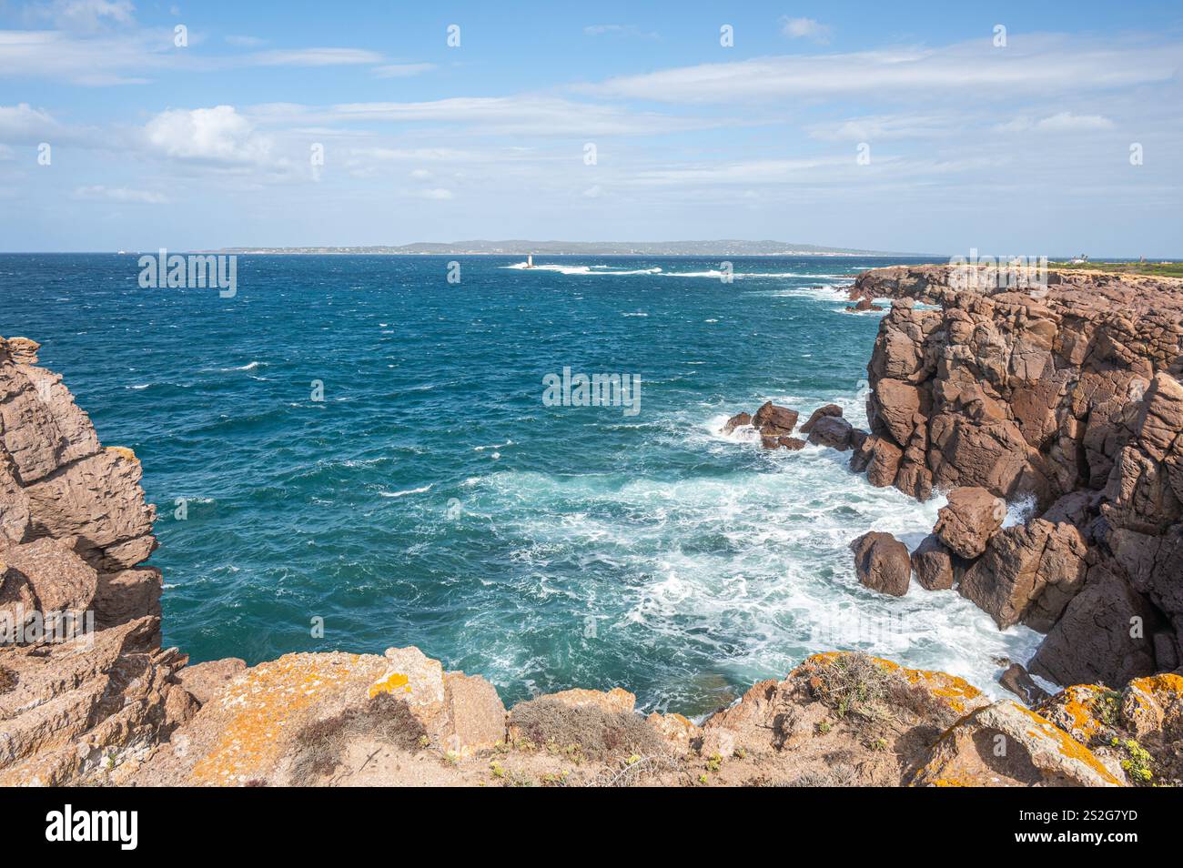 The beautiful high red cliffs of Nido dei Passeri on the island of Sant ...