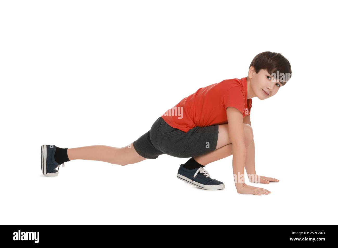 Boy doing exercise on white background. Sport activity Stock Photo - Alamy