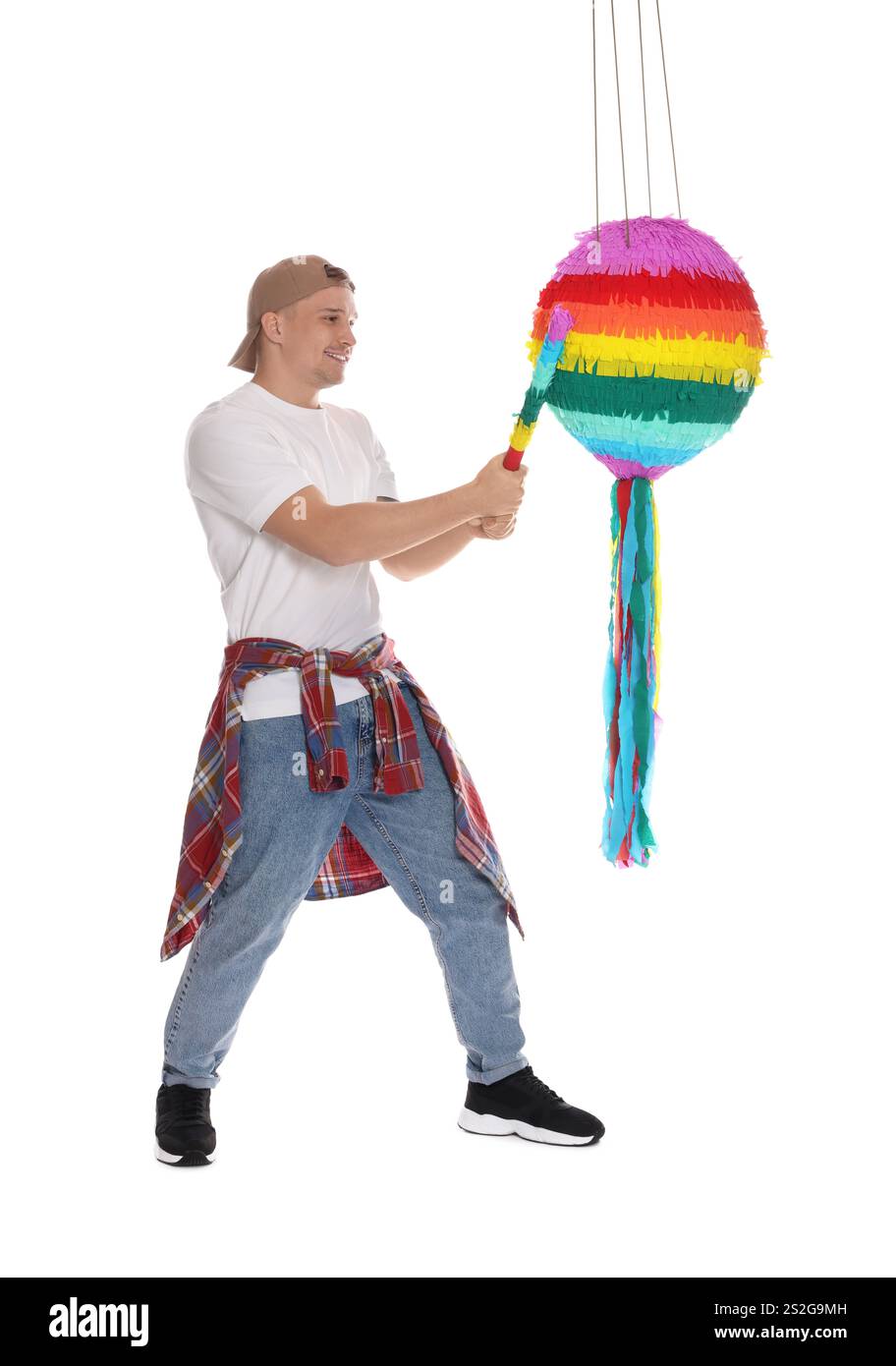 Happy man breaking pinata on white background Stock Photo - Alamy