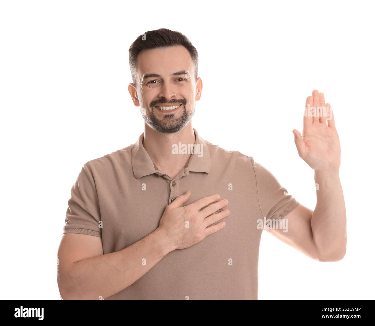 Man making promise with raised hand on white background. Oath gesture ...
