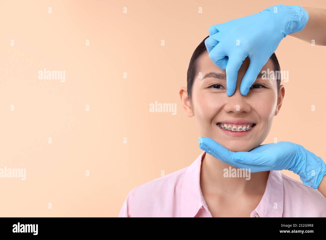Doctor checking patient's nose before plastic surgery operation on ...