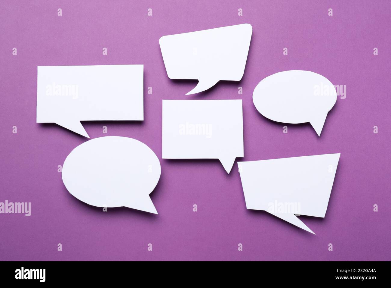 Blank speech bubbles on purple background. Space for text Stock Photo ...