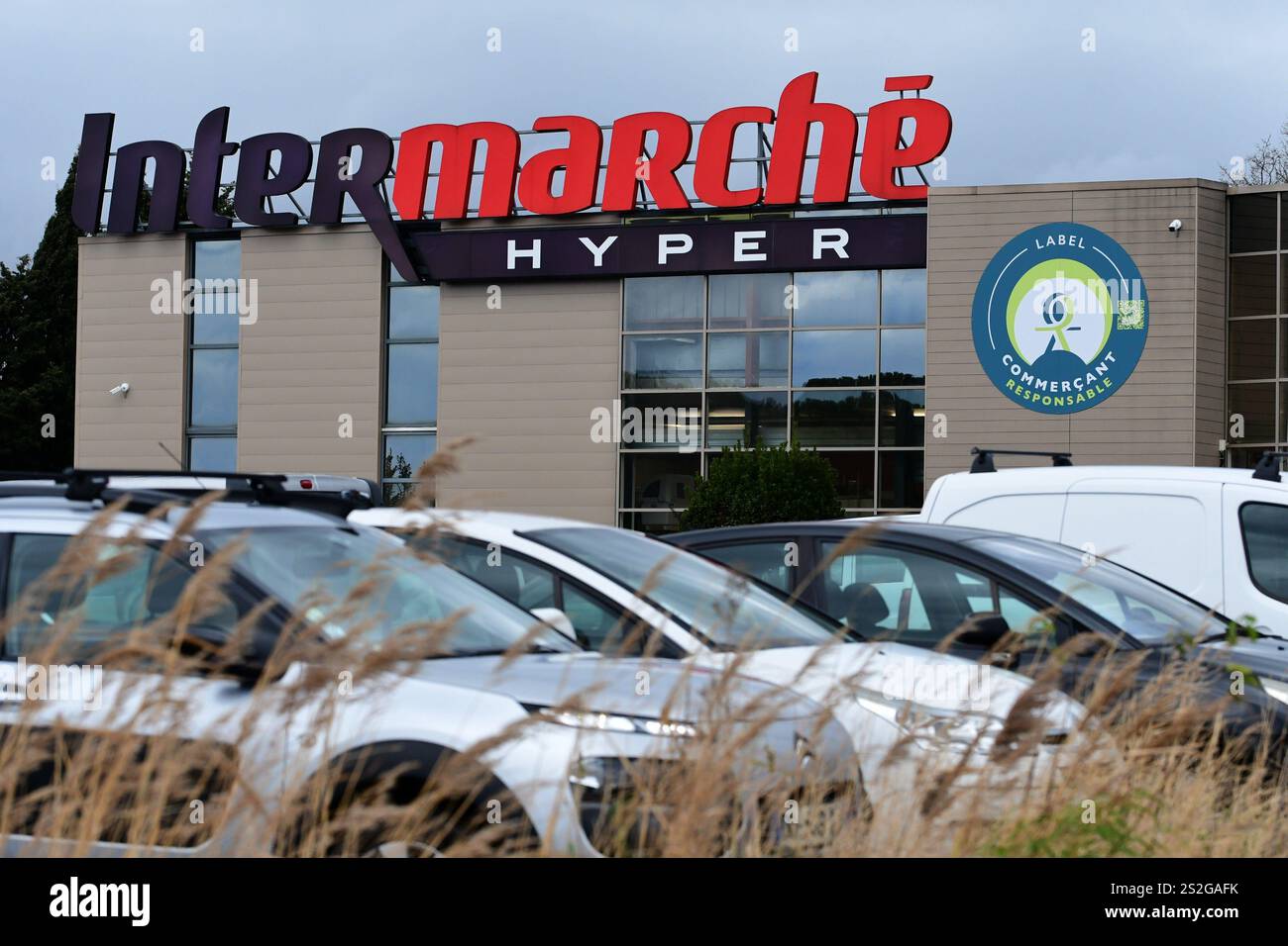 Cars are seen at Intermarche food store in Saint Maurice l Exil. (Photo ...